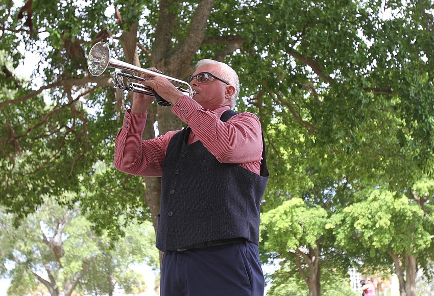 Your Observer | Photo - Danny Bilyeu plays Taps.