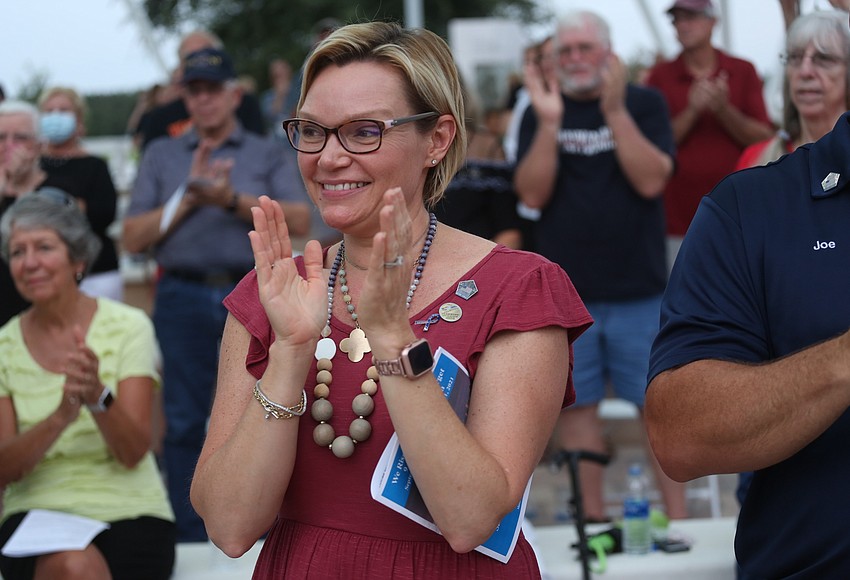Your Observer | Photo - Allie Cooper claps in respect.