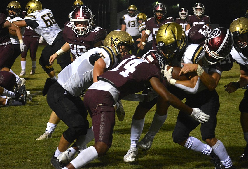 Your Observer | Photo - Pirates sophomore Jamarie Rutledge (14) lays a ...