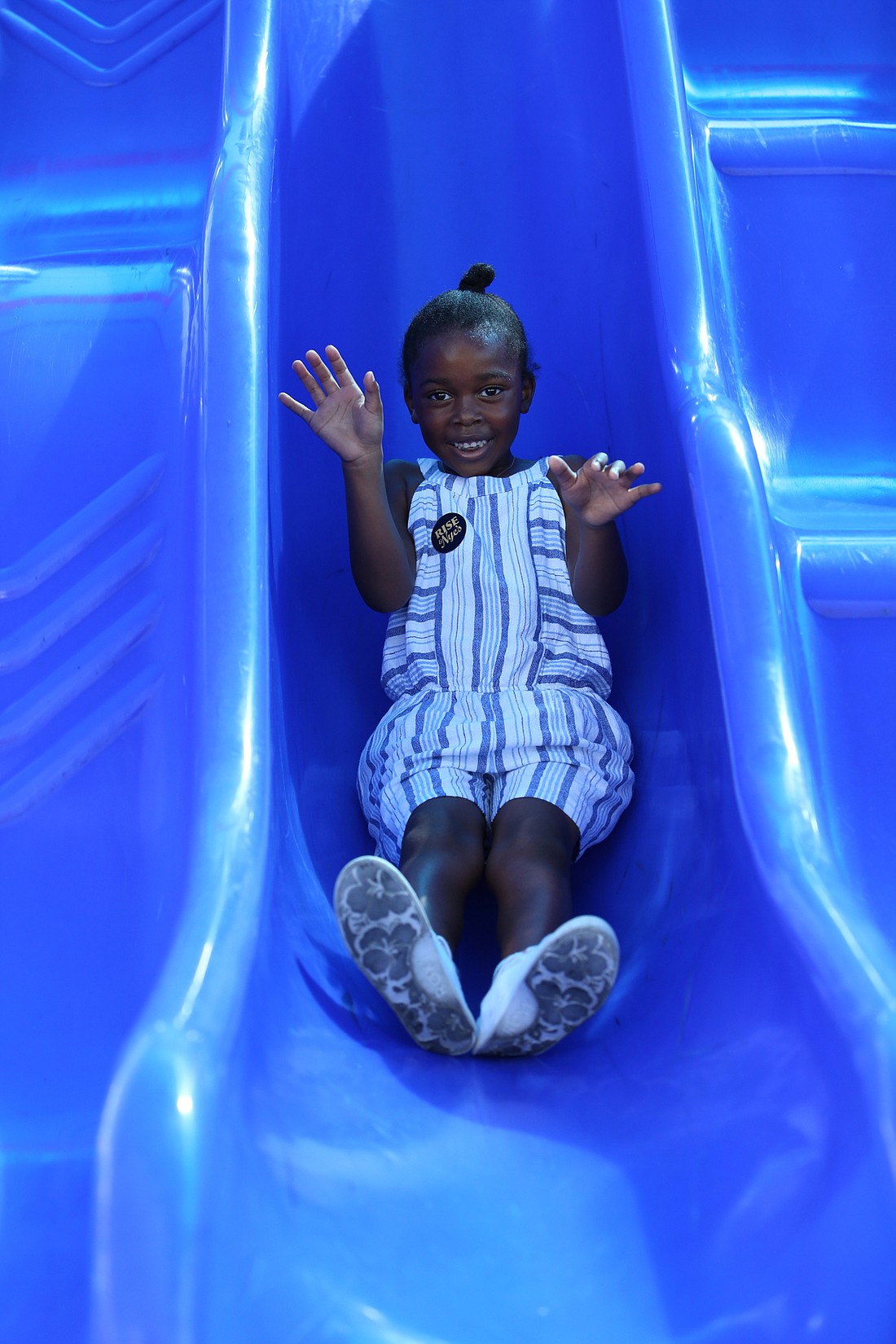 Your Observer | Photo - Mia Rumph goes down the slide.