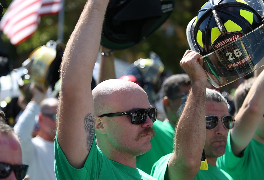 Your Observer | Photo - Dillon Wade with Station 26 raises his helmet ...