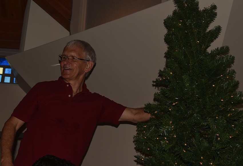 Your Observer | Photo - Steve Gunderson fluffs the boughs on a tree in ...