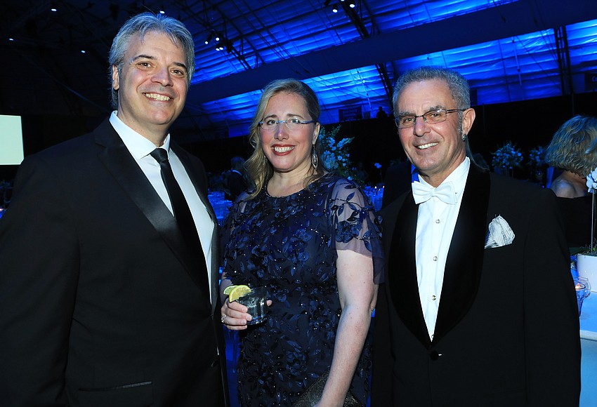 Your Observer | Photo - Rob and Jennifer Rominiecki with Kelvin Cooper