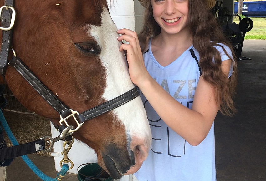 Amanda Jacobson collecting for horse group at Tack Boutique | West ...