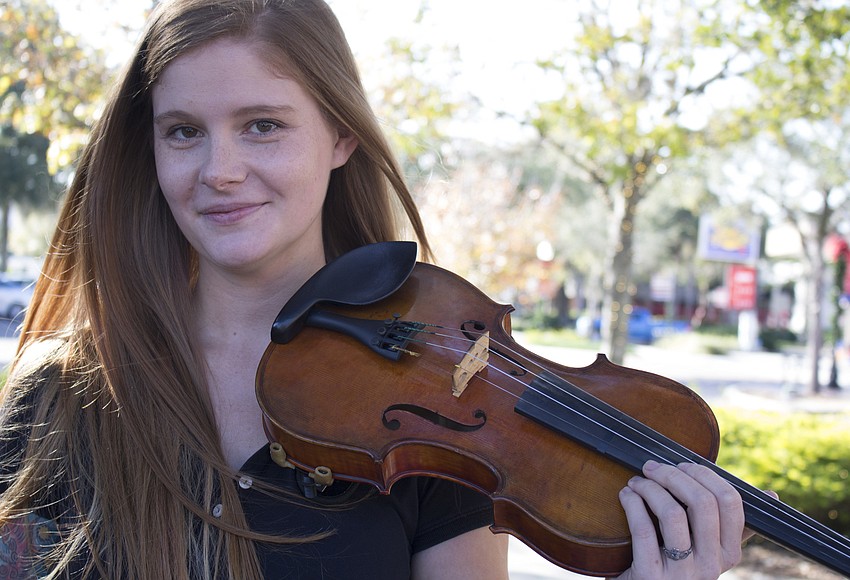 The violin lady: street musician delights locals with classical music ...