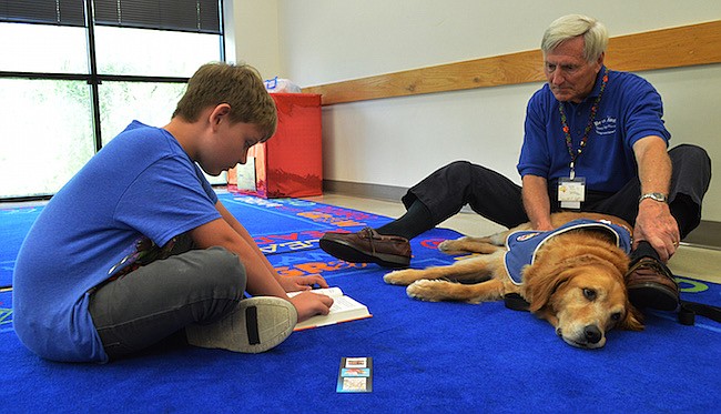 Book program encourages children to read with therapy dogs | West ...