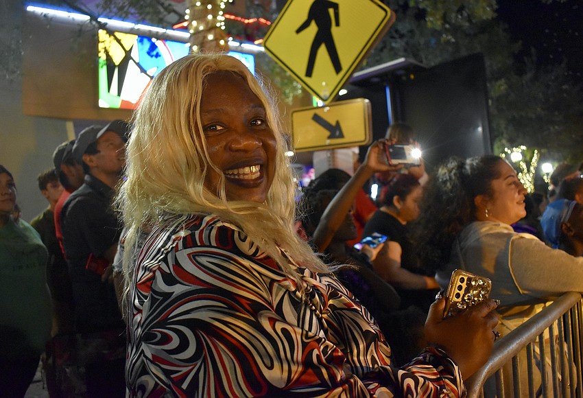 Your Observer | Photo - Kimla Murrell cheers at the parade floats.