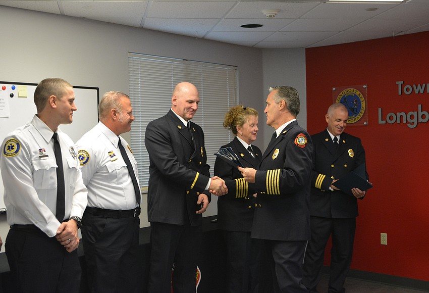 Your Observer | Photo - Lt. Tim Haas shakes the hand of Chief Paul ...
