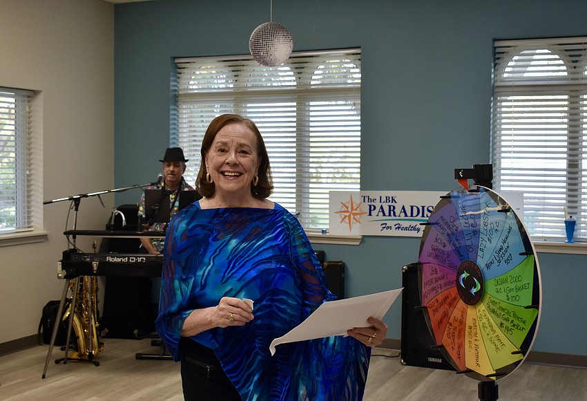 Your Observer | Photo - Vicki Lyons takes a spin and wins a prize.