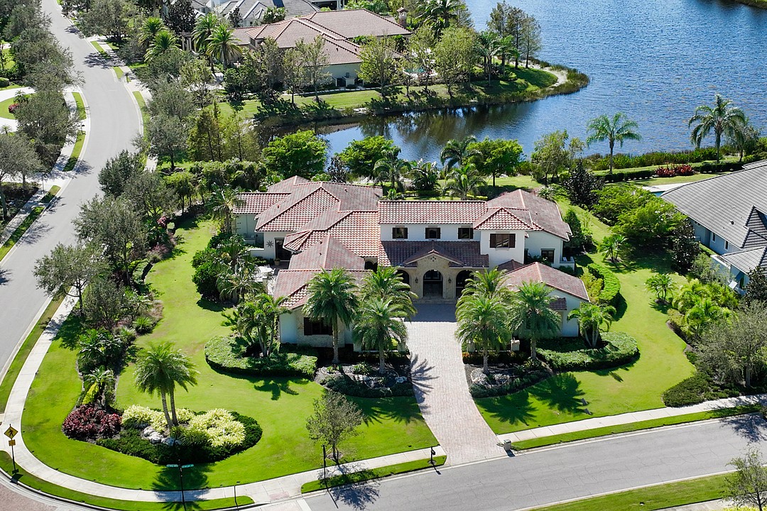 Graceful estate in The Lake Club embraces the natural world just beyond ...