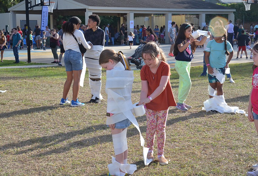 West Orange Times & Observer | Photo - The mummy race using rolls of ...