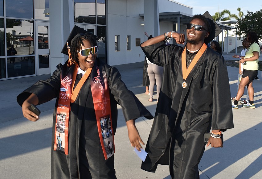 Your Observer | Photo - Cymari Brewer and Caleb Bradley dance as they prepare for graduation.
