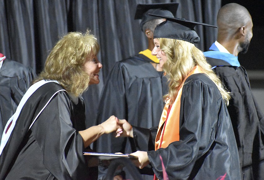 Your Observer | Photo - School board member Robyn Marinelli greets ...