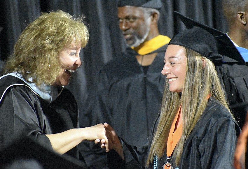 Your Observer | Photo - School board member Robyn Marinelli shakes ...