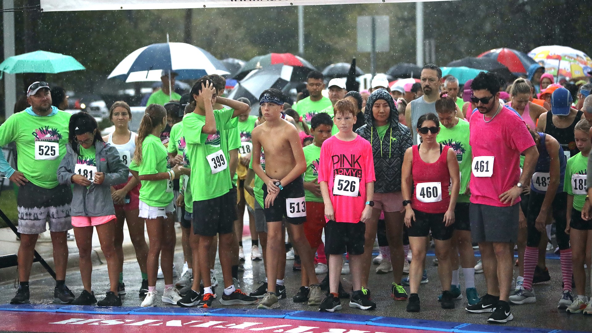 In the pink: Rain doesn't dampen spirits of hundreds participating in ...