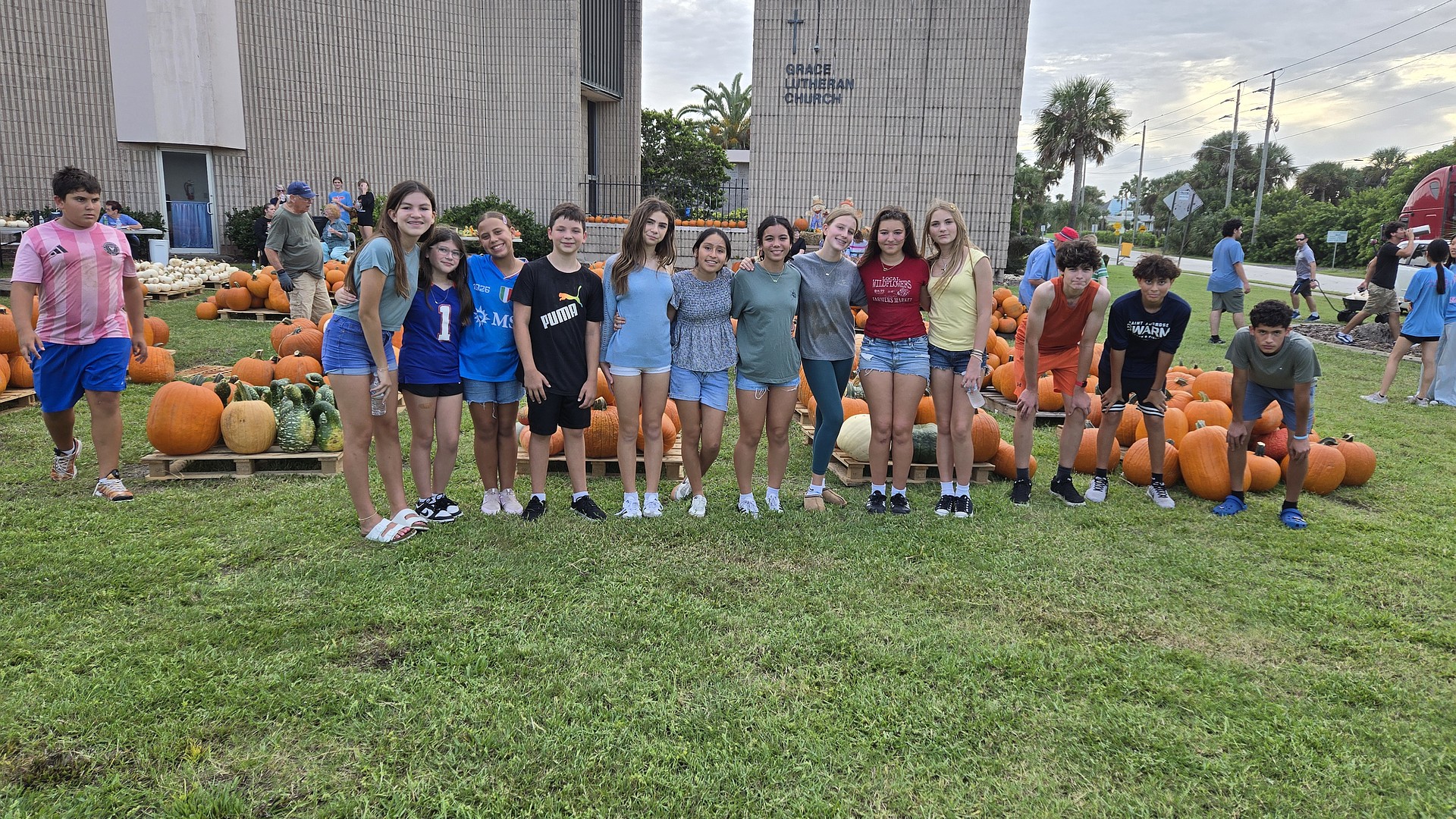 Students help unload over 700 pumpkins at Grace Lutheran Church in ...