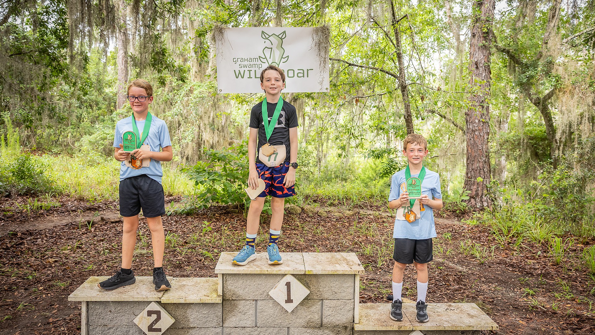 Run wild: Kids 3-14 run the Graham Swamp Trail in the Wild Boar Run ...